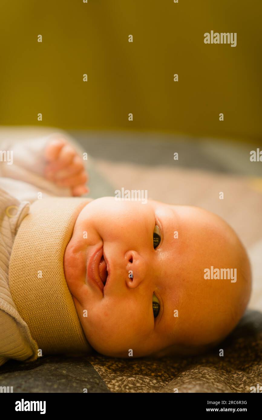 Cute newborn baby in a neck brace. Kid wearing cervical collar ...