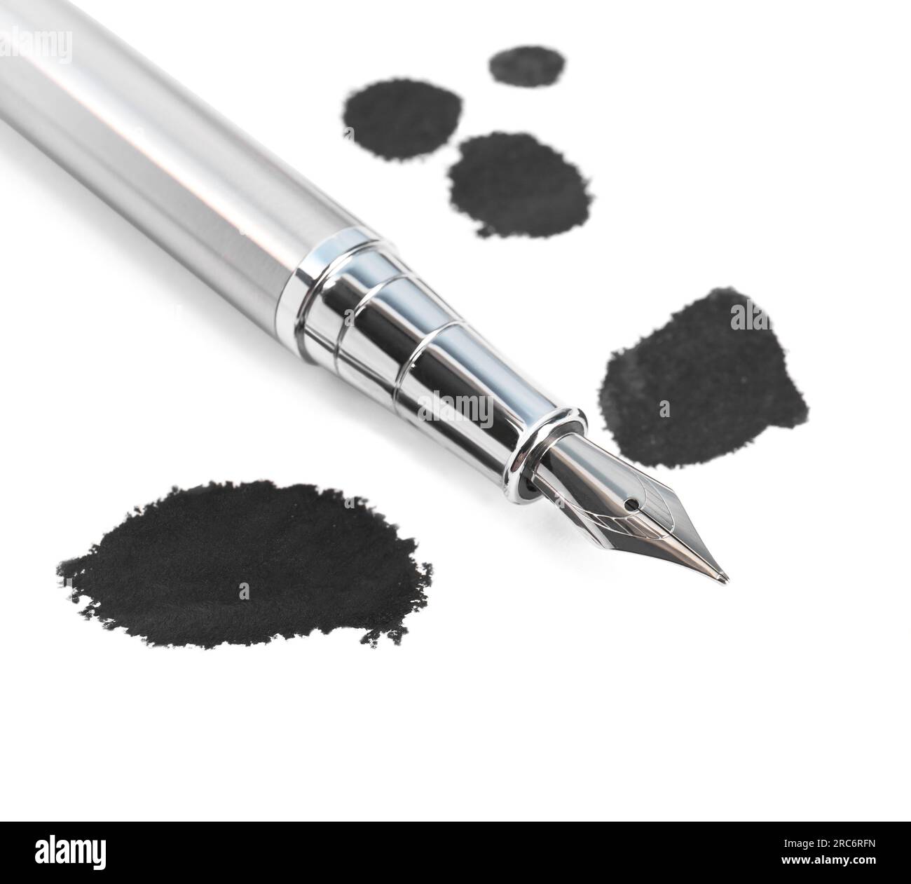 Stylish silver fountain pen and blots of ink isolated on white Stock ...