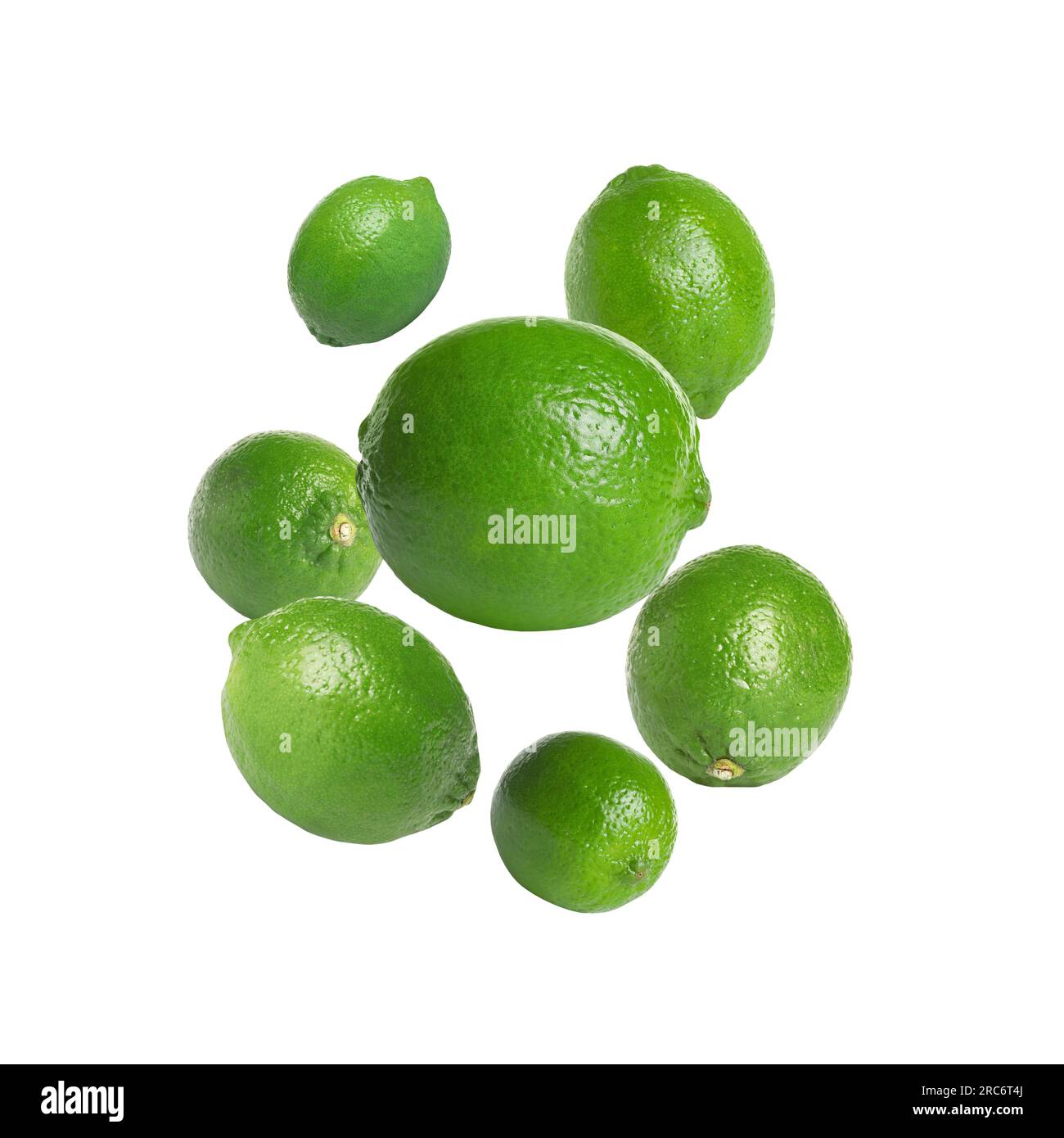 Fresh lime fruits falling on white background Stock Photo - Alamy