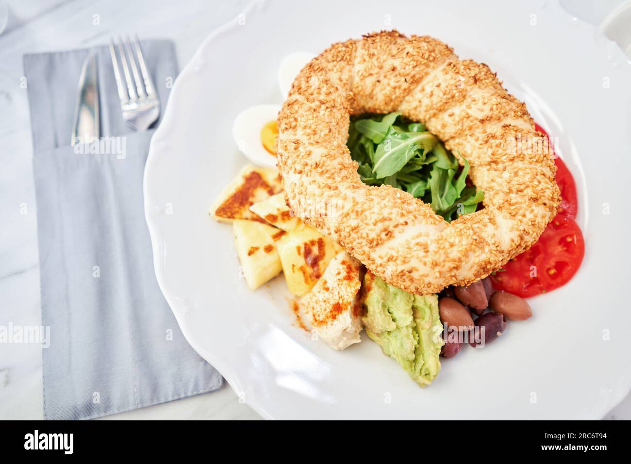 Turkish breakfast with simit, cheese, tomato, cucumber, olives ...