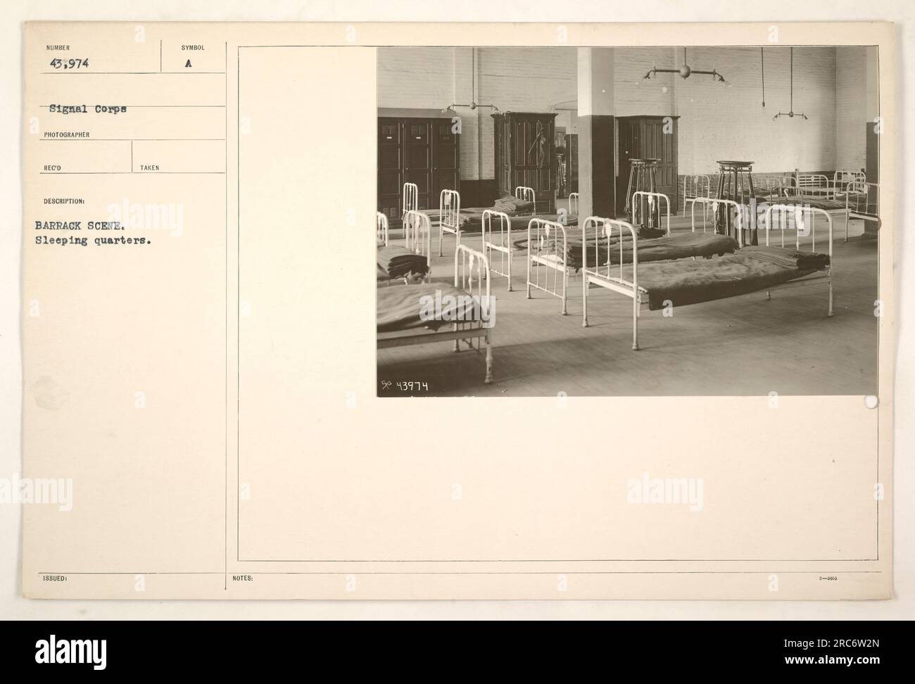 Caption: A photograph taken during World War I shows a barrack scene ...