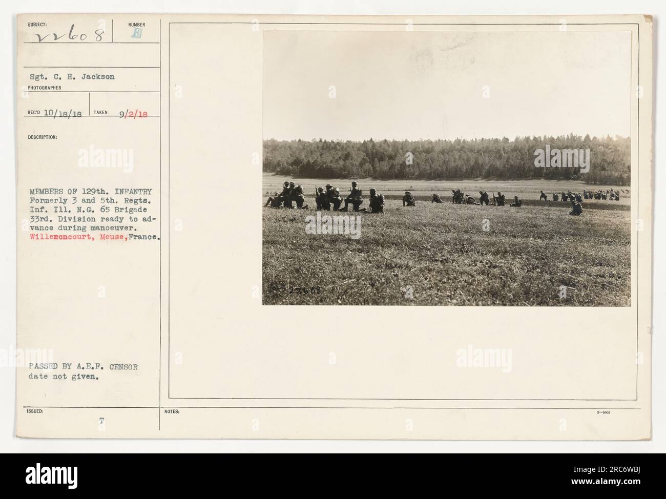Caption: "Sgt. C. H. Jackson leads a group of soldiers from the 129th ...