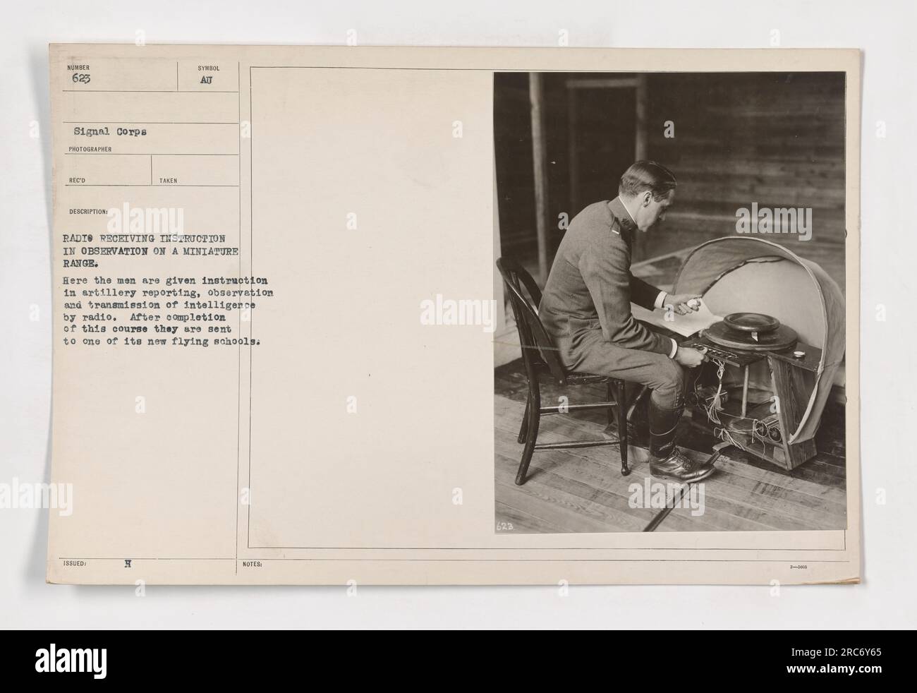 Signal Corps officer receiving instruction on artillery reporting ...