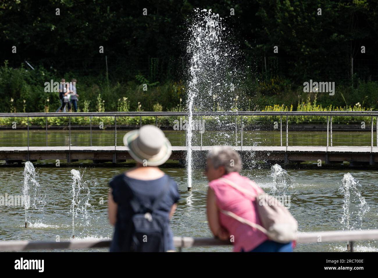 Bad Gandersheim, Germany. 12th July, 2023. Visitors stand in front of a ...
