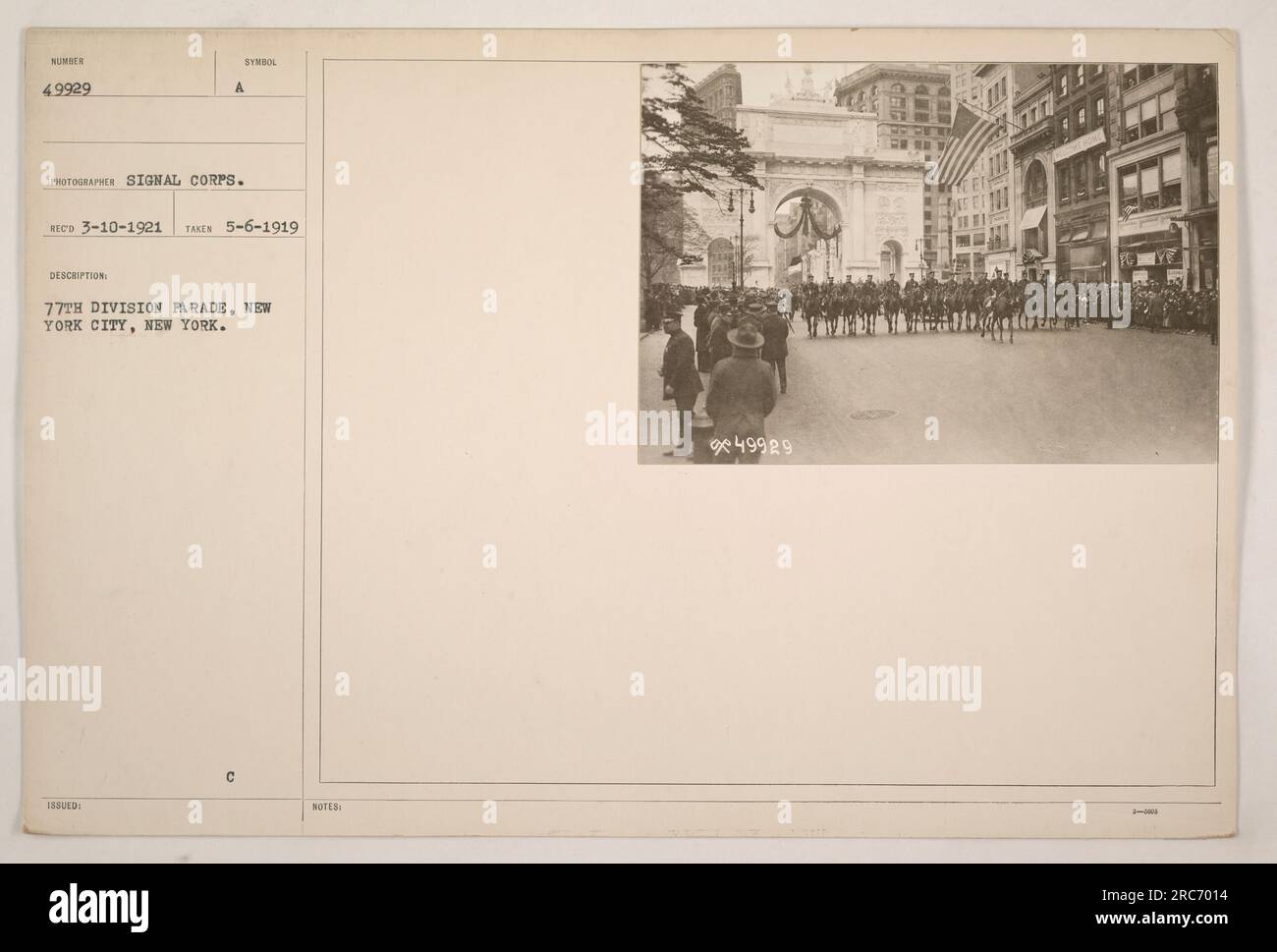 The image shows the 77th Division parade in New York City, New York. It ...