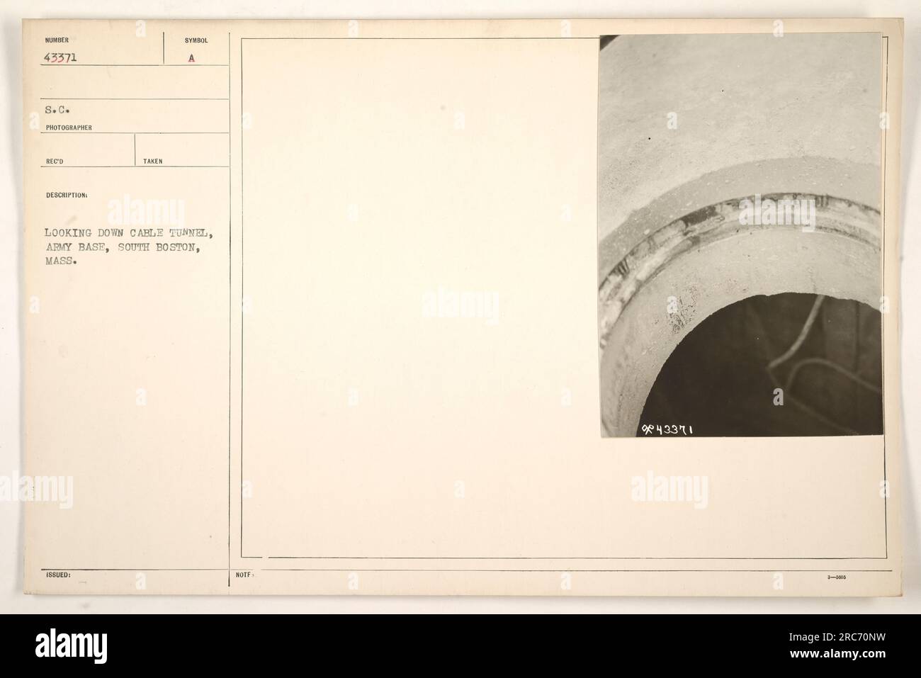 Soldiers inspecting a cable tunnel at an army base in South Boston ...