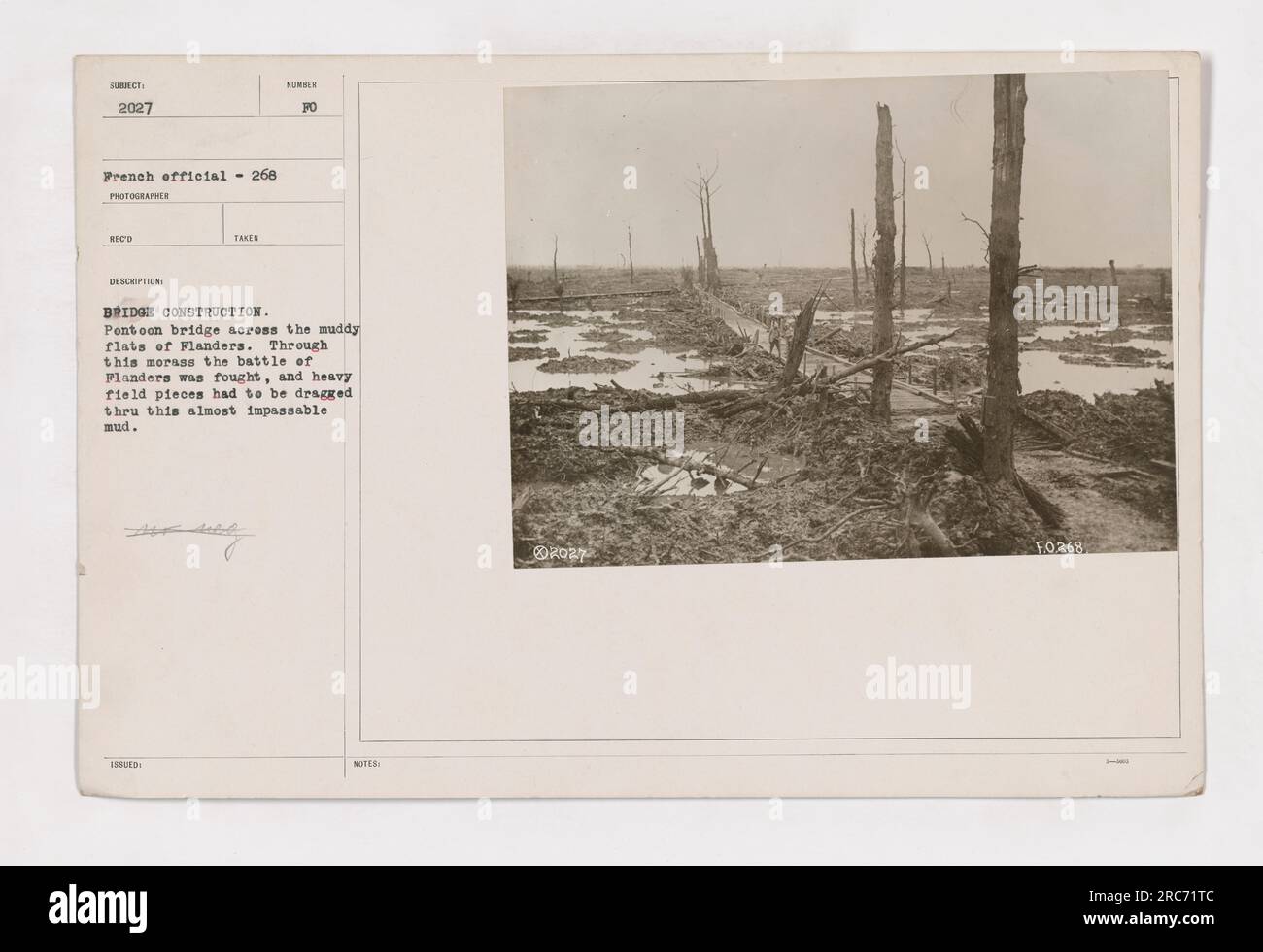 A pontoon bridge constructed across the muddy flats of Flanders during ...