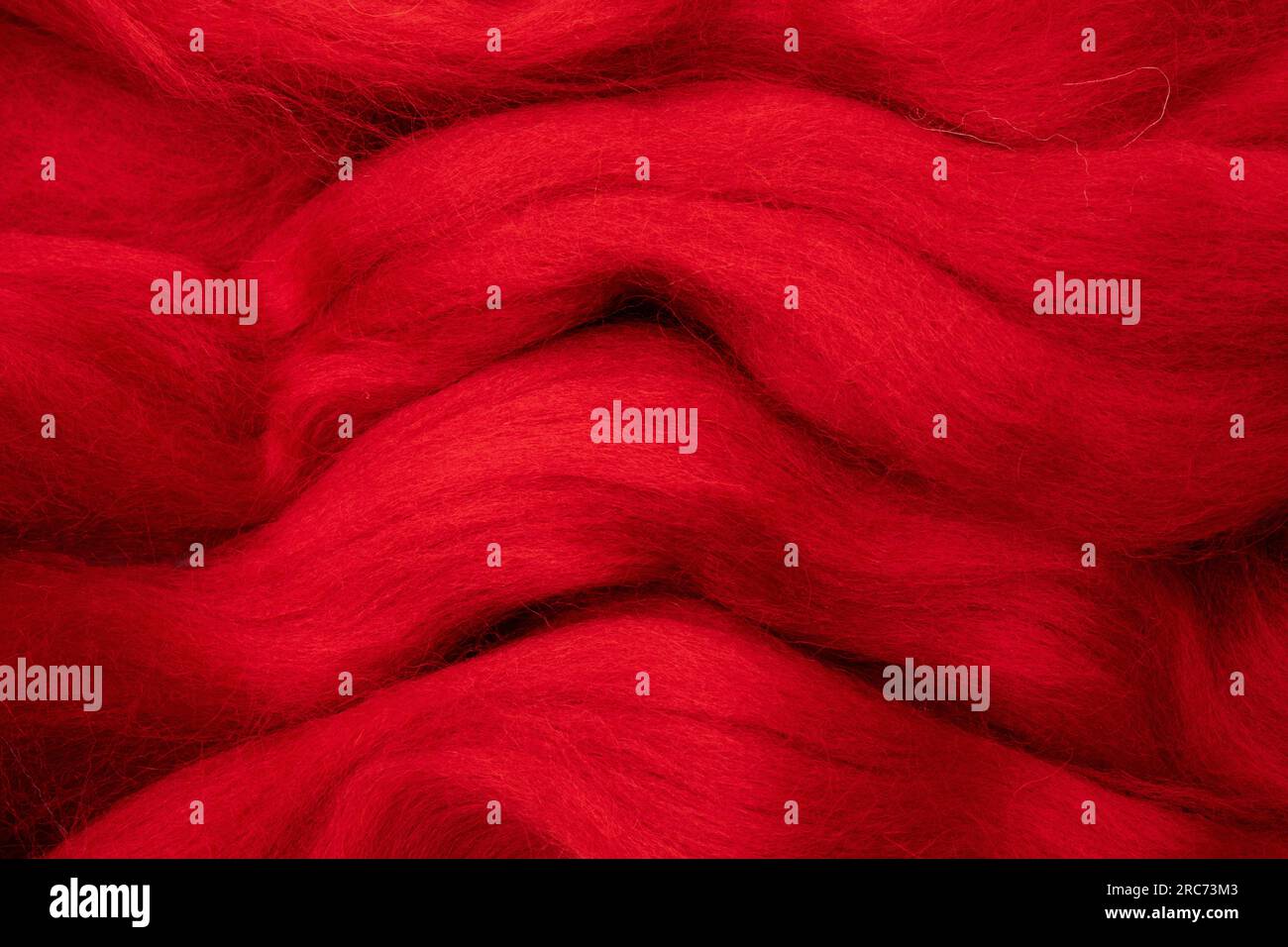 Red merino wool for felting as background Stock Photo - Alamy
