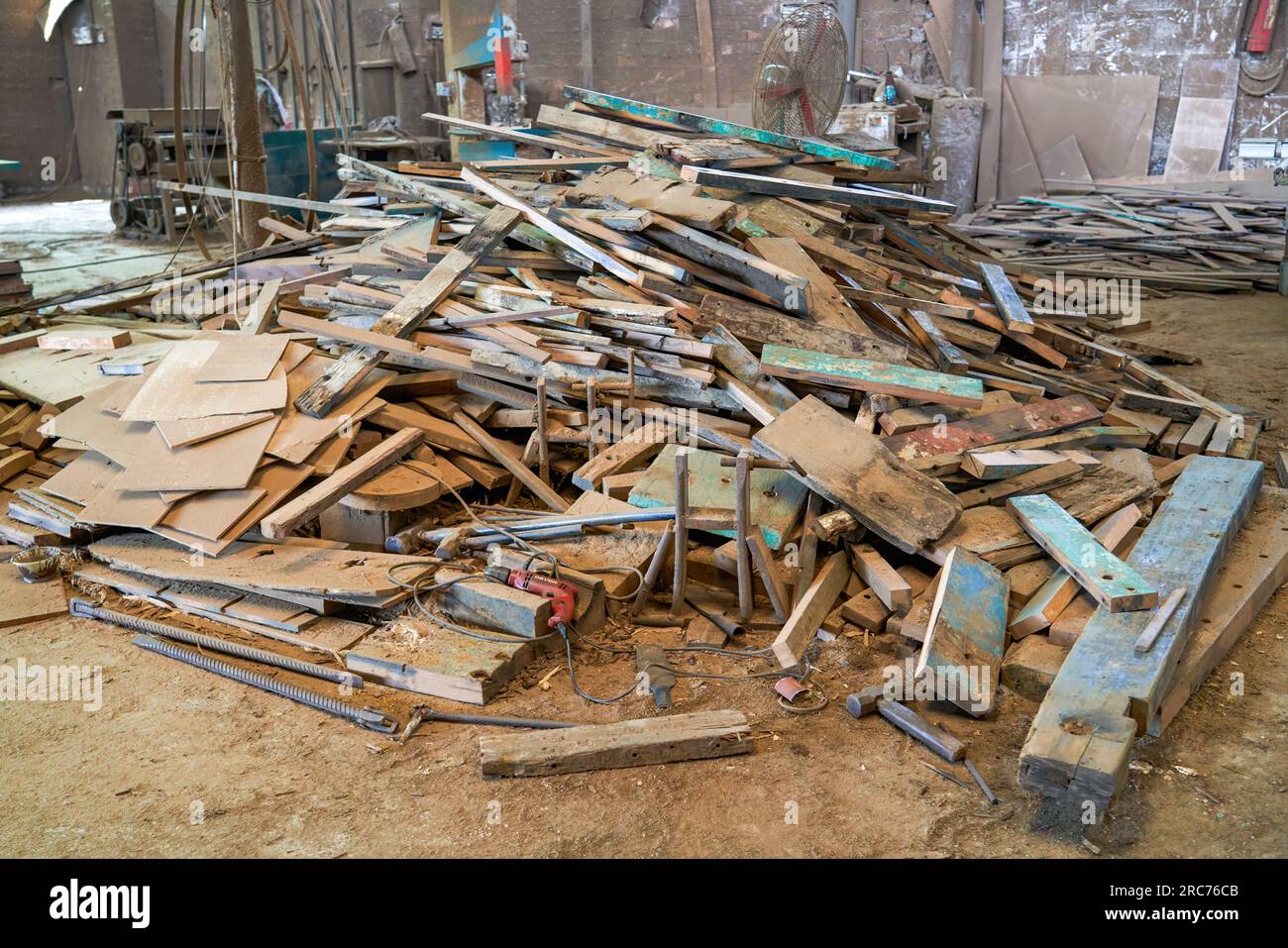 A busy and messy furniture processing factory Stock Photo - Alamy