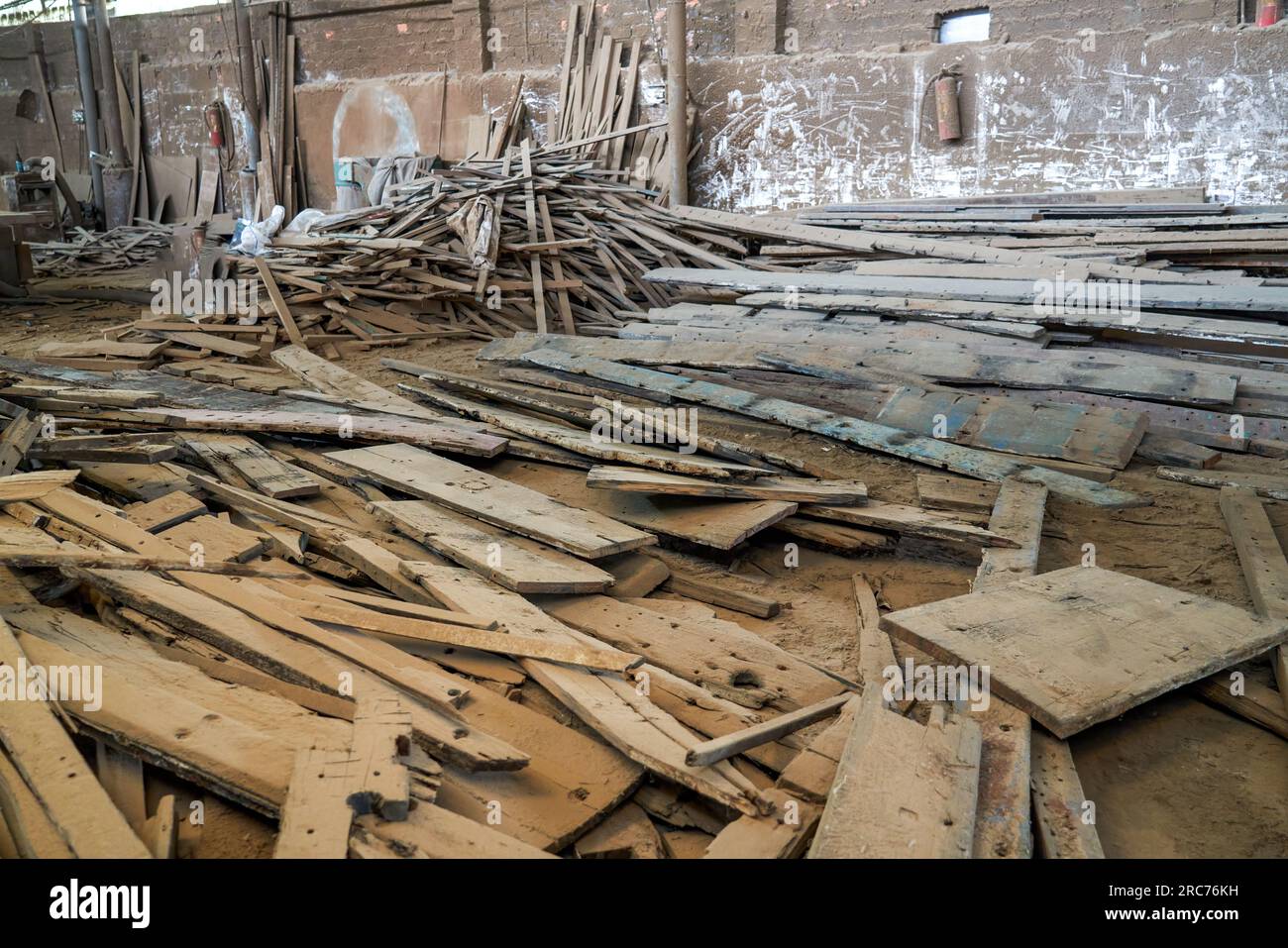 A busy and messy furniture processing factory Stock Photo - Alamy