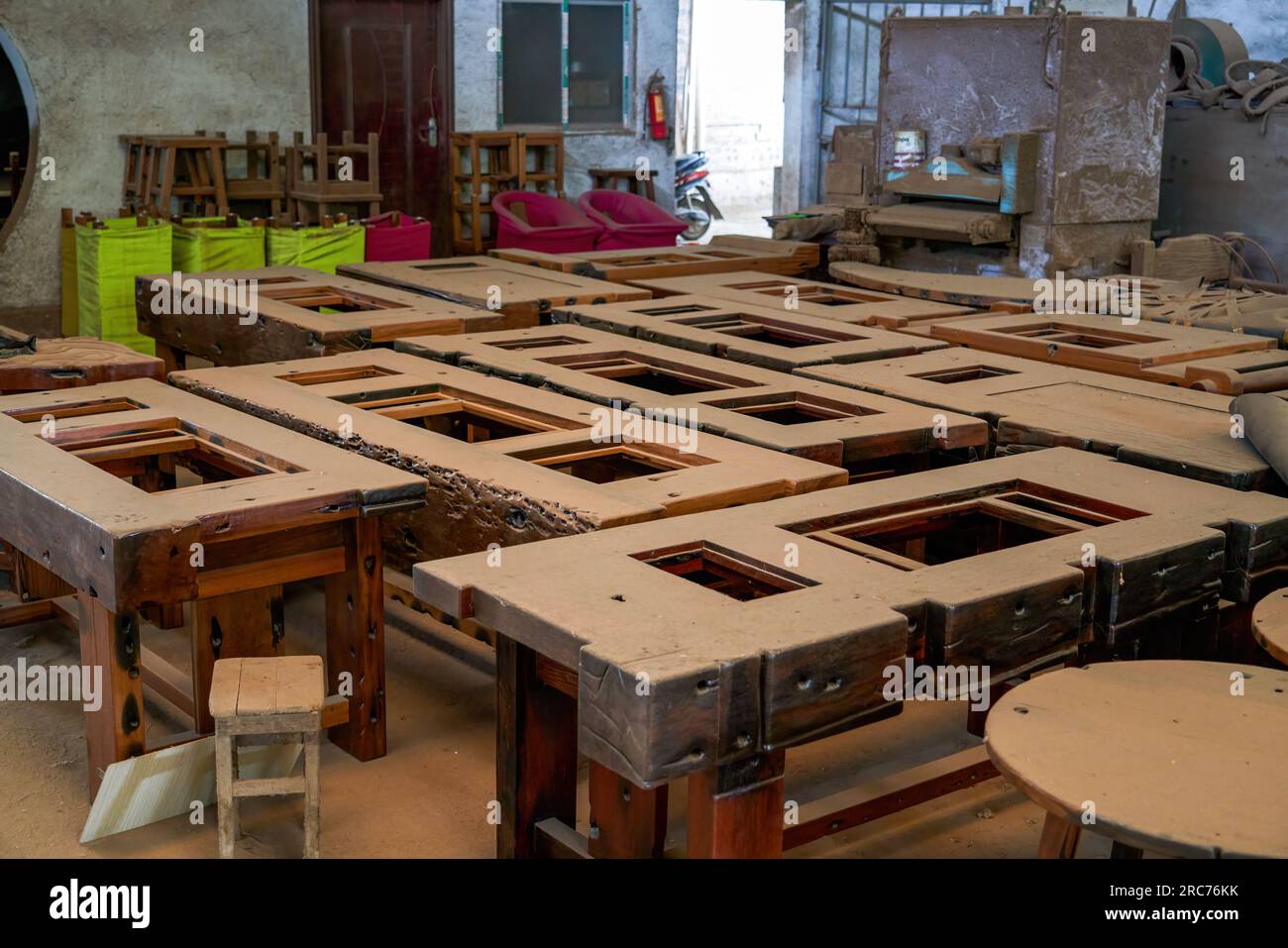 A busy and messy furniture processing factory Stock Photo - Alamy