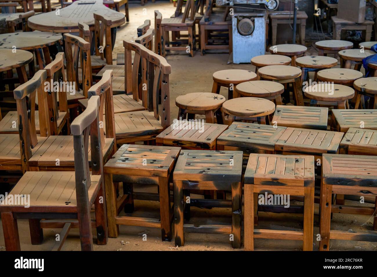 A busy and messy furniture processing factory Stock Photo - Alamy