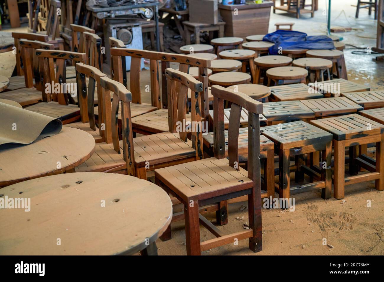 A busy and messy furniture processing factory Stock Photo - Alamy