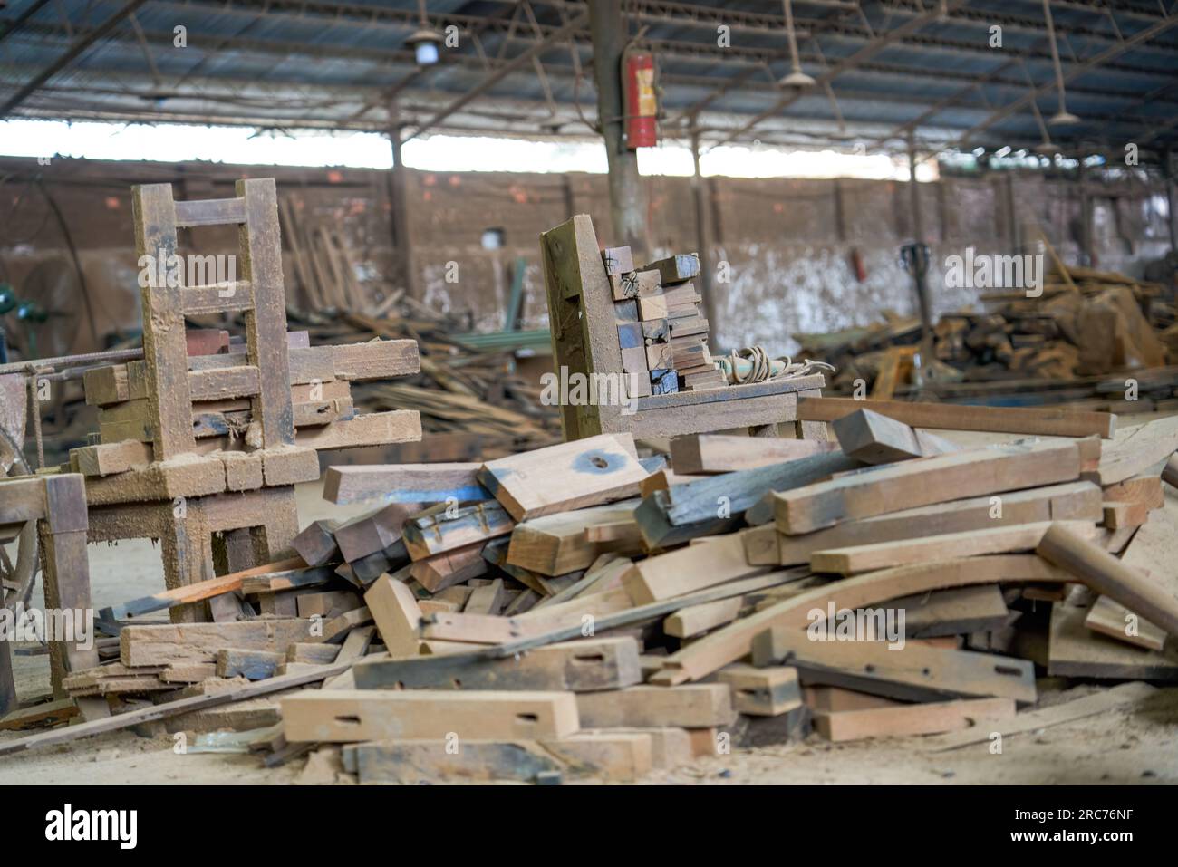 A busy and messy furniture processing factory Stock Photo - Alamy