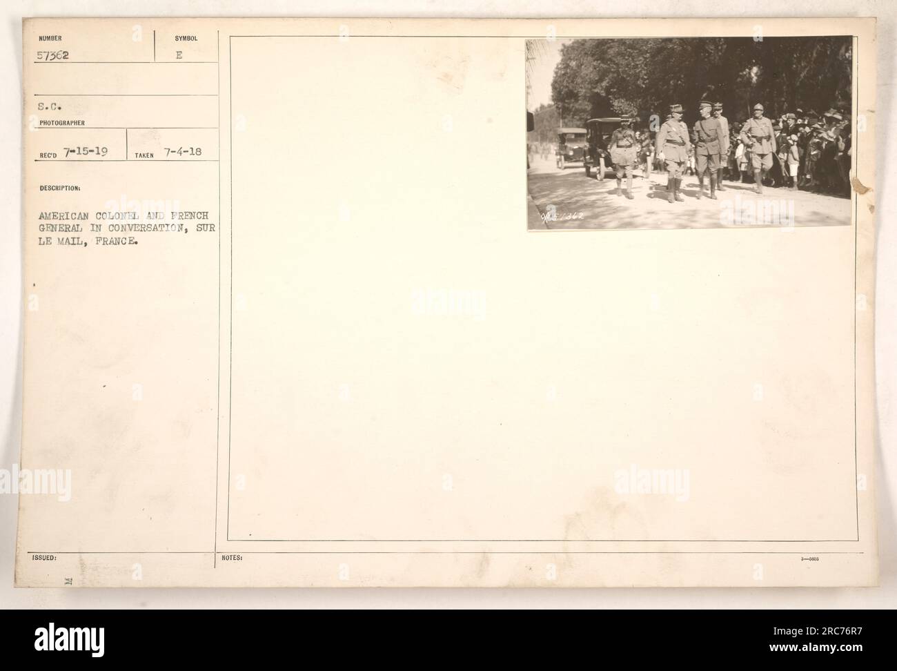 An American colonel and French general are seen engaged in conversation ...