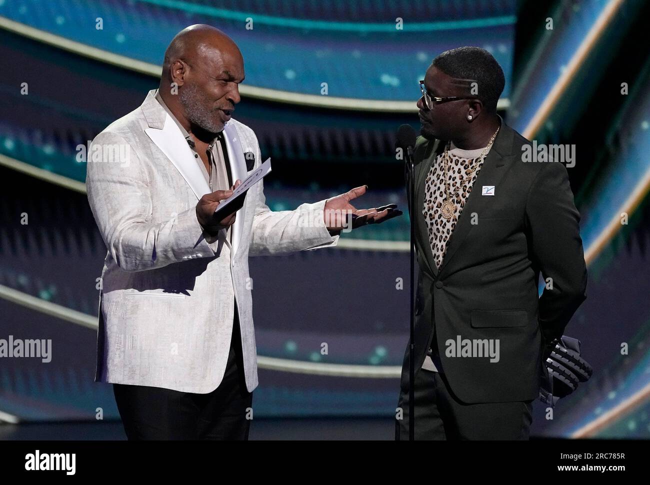 Mike Tyson, left, and Lil Rel Howery present the award for best team at the ESPY awards on ...
