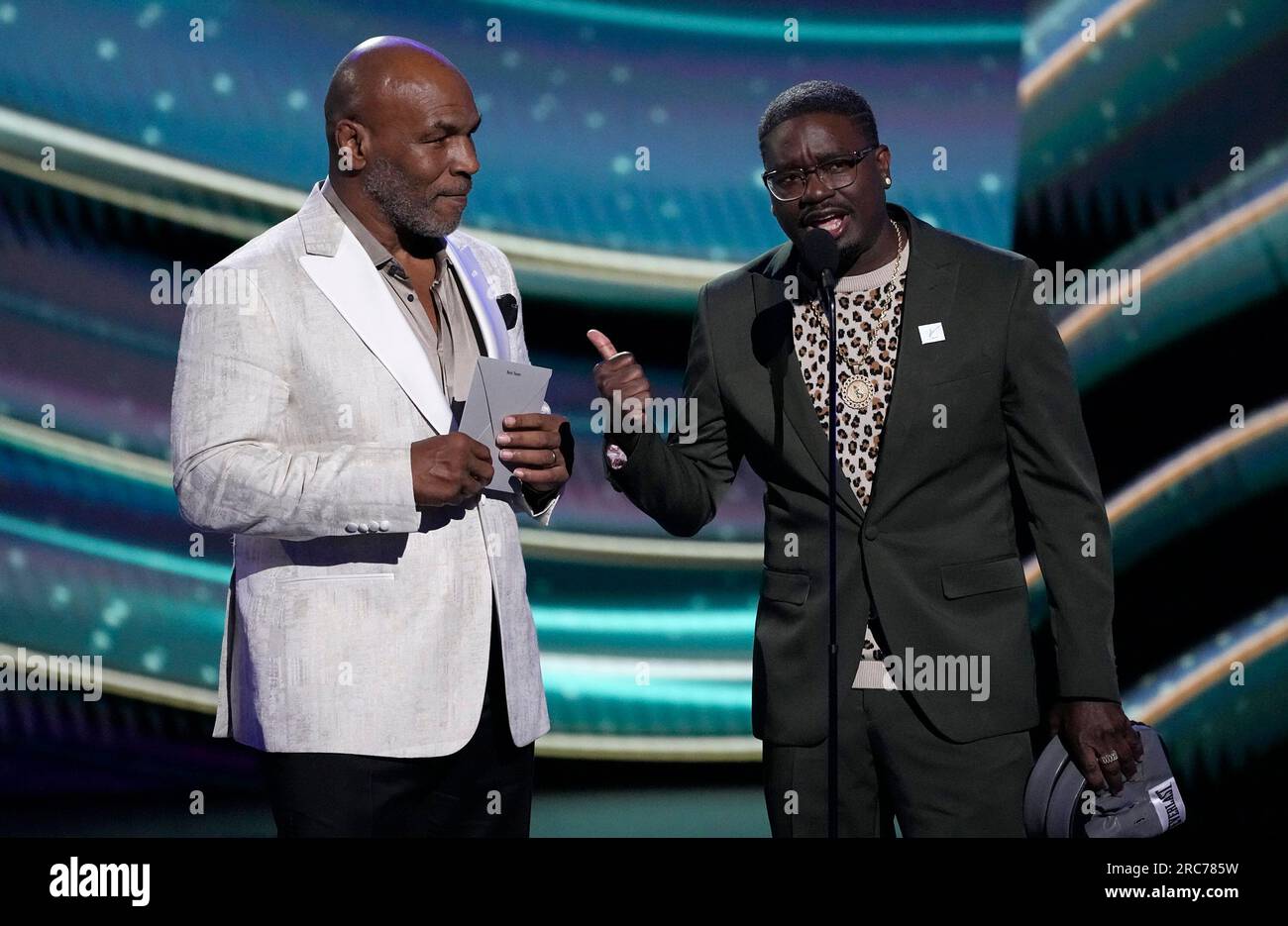 Mike Tyson, left, and Lil Rel Howery present the award for best team at the ESPY awards on ...