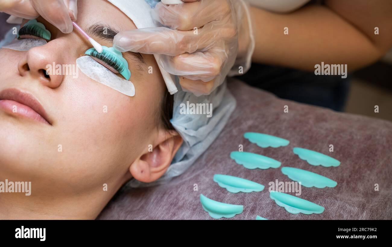 The master removes the composition for lamination from the client's ...