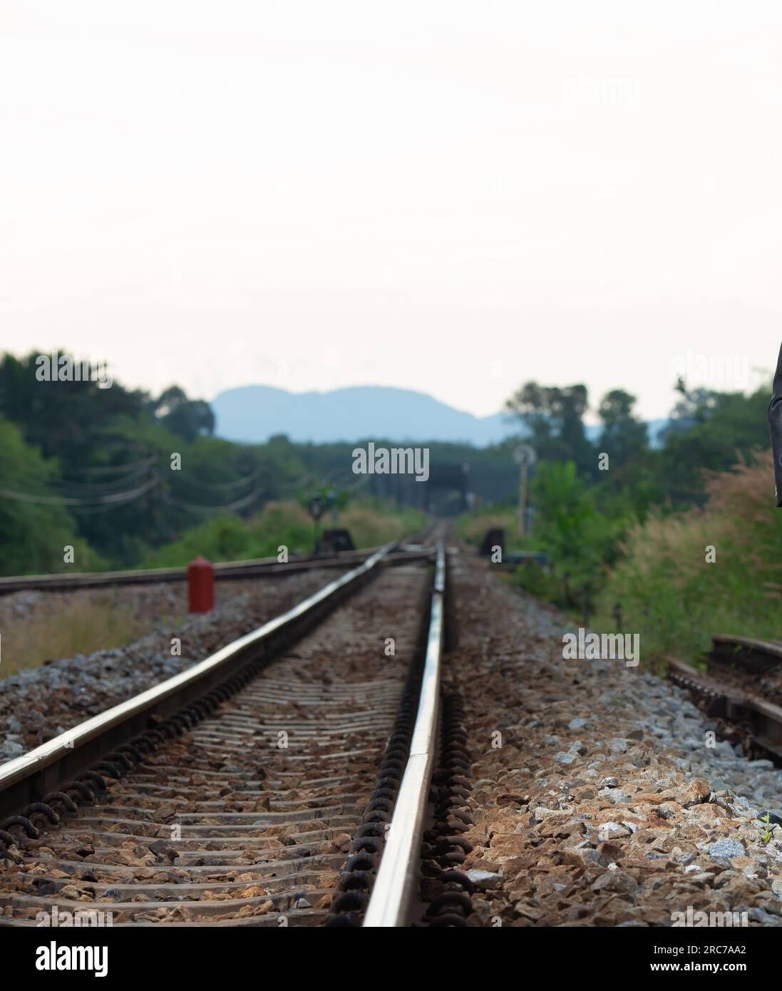 single track linear rail The background is dark blue sky and mountains ...