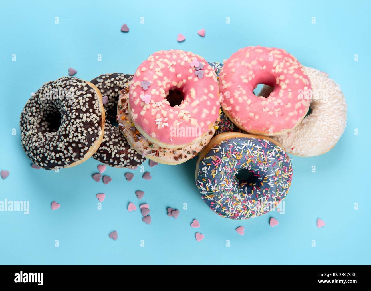 Donuts pattern. Top view of assorted glazed donuts. Colorful donuts with icing. Various colorful ...
