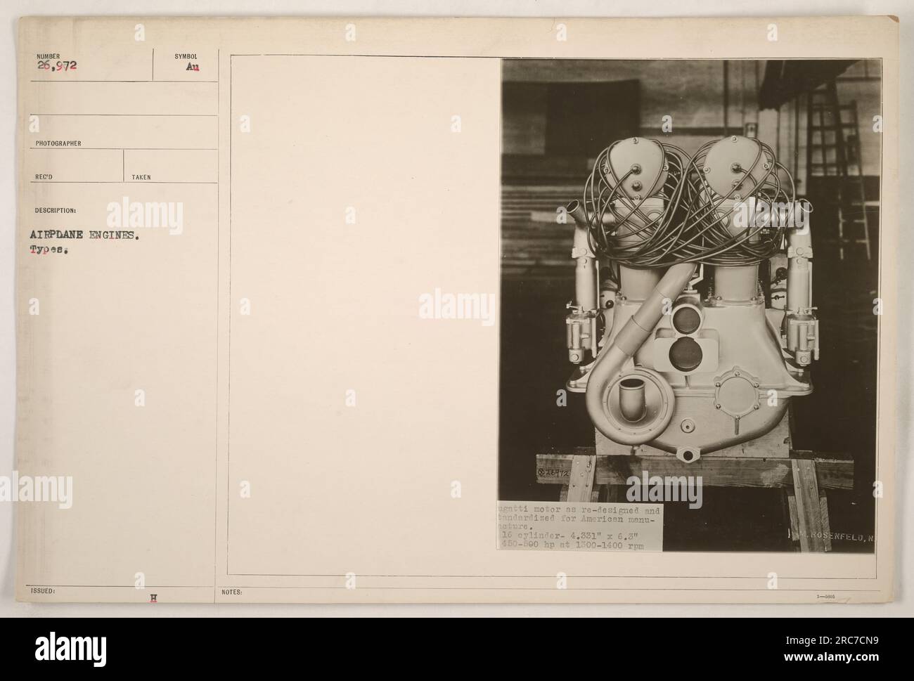 Close-up photograph of airplane engines being inspected and worked on ...