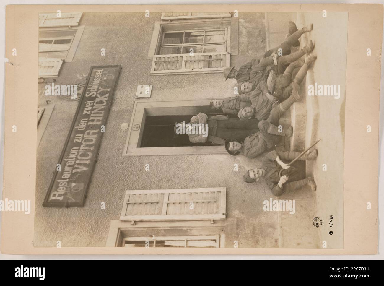 A group of soldiers are seen participating in the restoration of a war ...