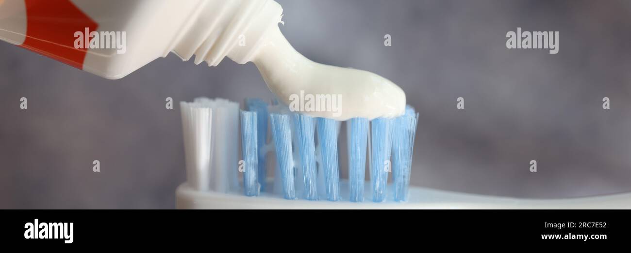 Squeezing tooth paste on toothbrush hi-res stock photography and images ...