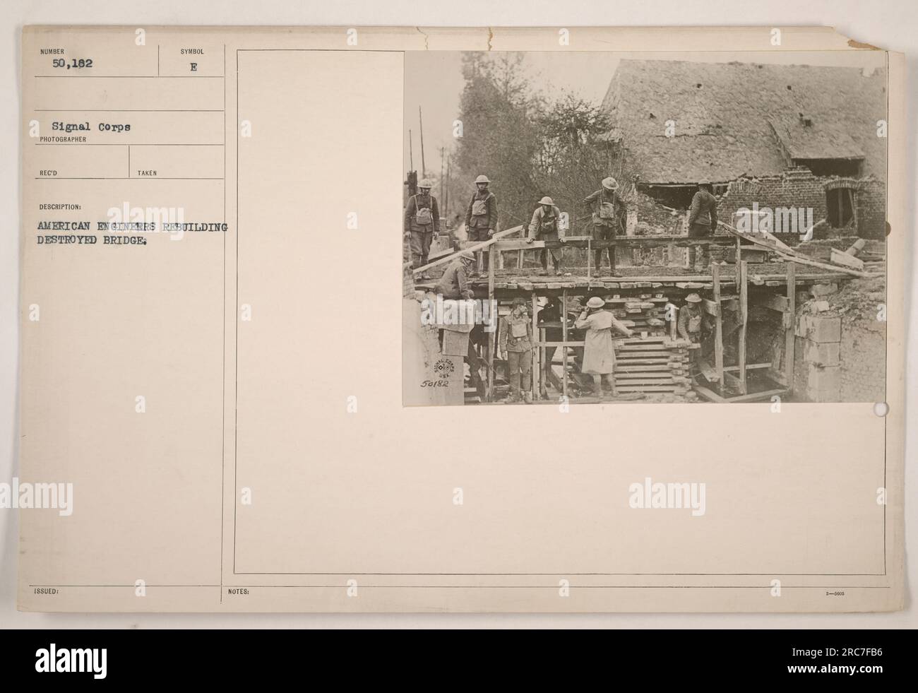 American engineers work together to rebuild a bridge that was destroyed ...