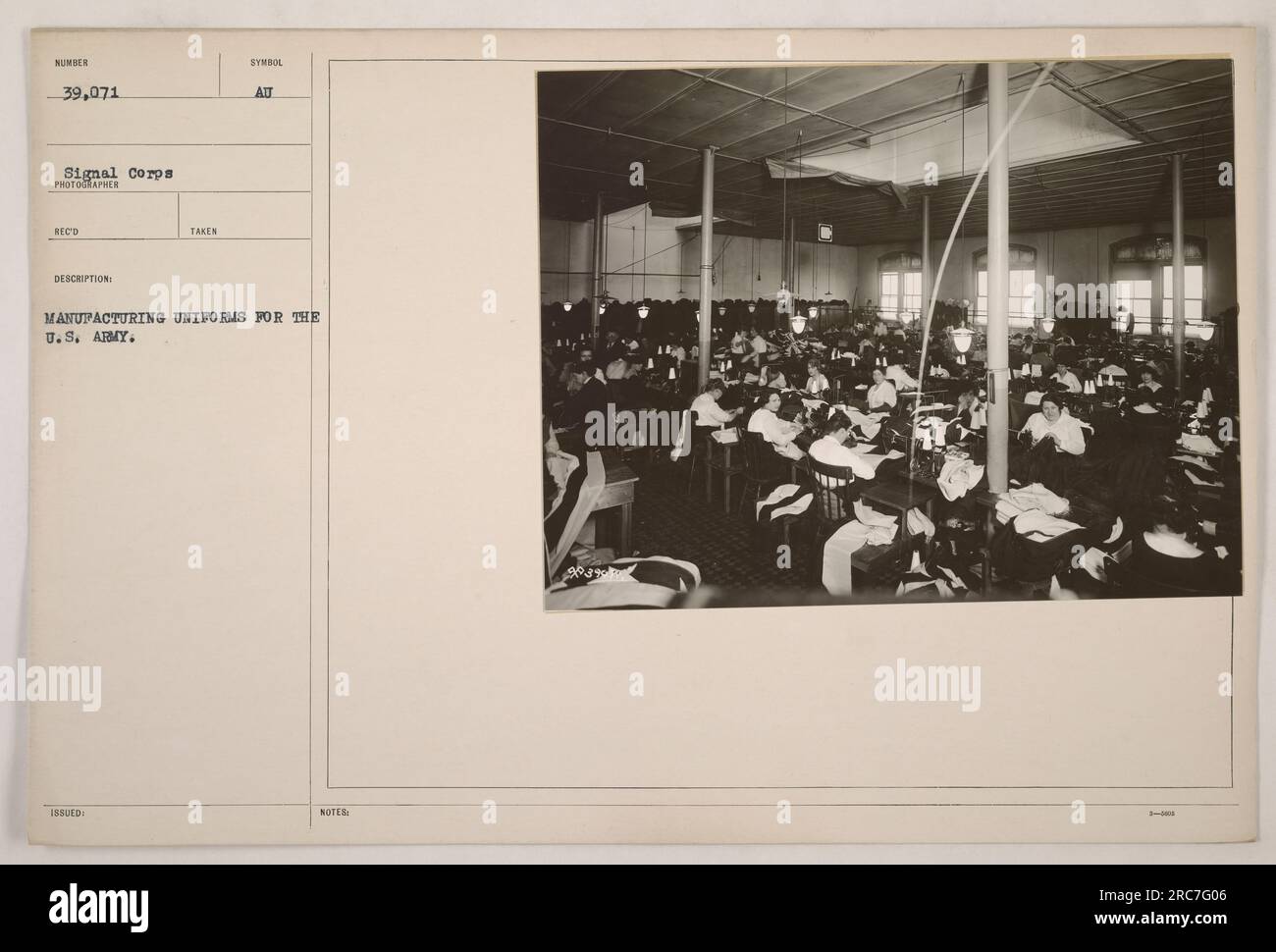 Workers inside a factory manufacturing uniforms for the U.S. Army ...