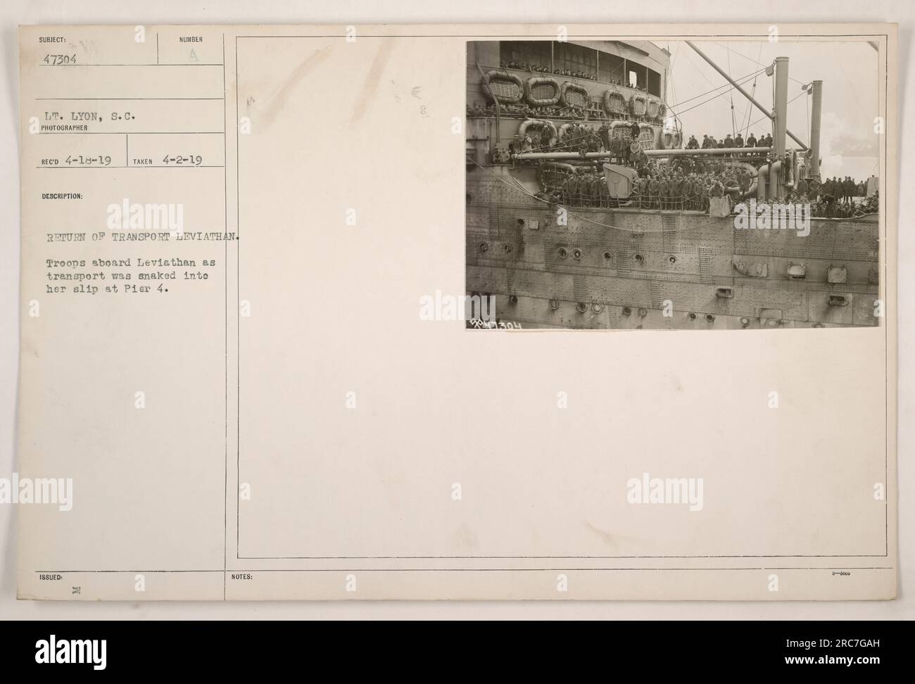 Troops aboard the transport Leviathan as it is being pulled into its ...