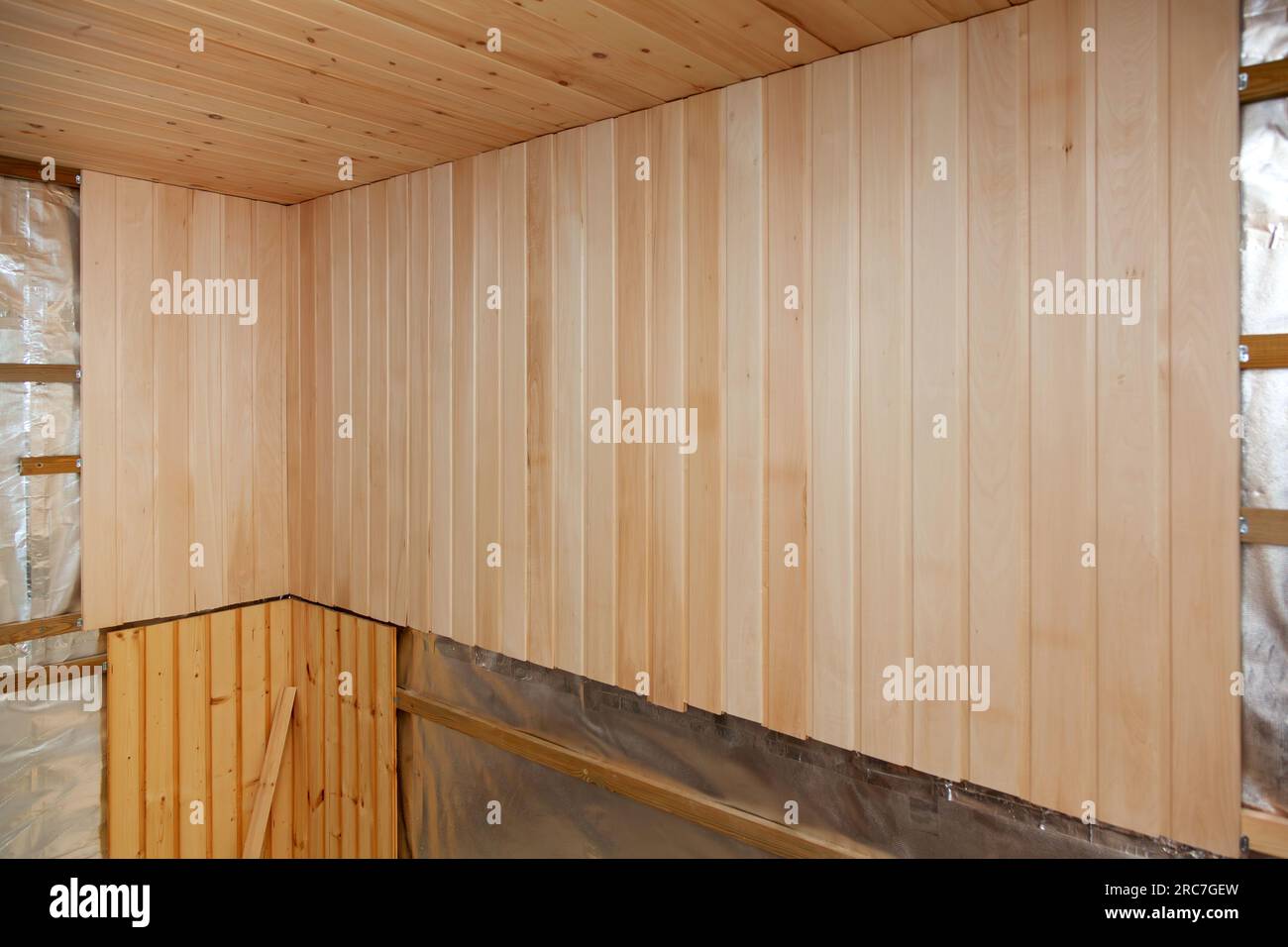 Interior of a new sauna under construction. Wooden walls and ceiling ...