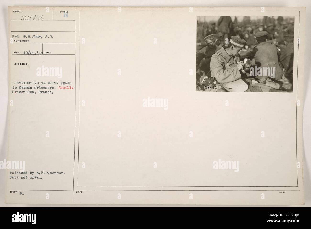 Caption: Pvt. T.R. Shaw, S.C., distributes white bread to German ...