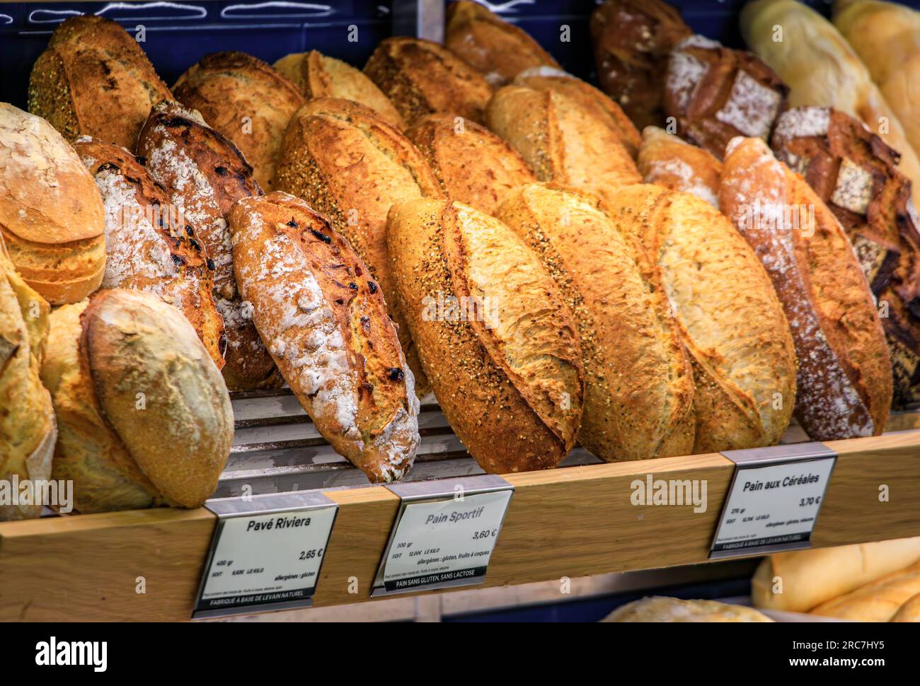 Loaves of freshly baked rustic French levain bread on display at an ...