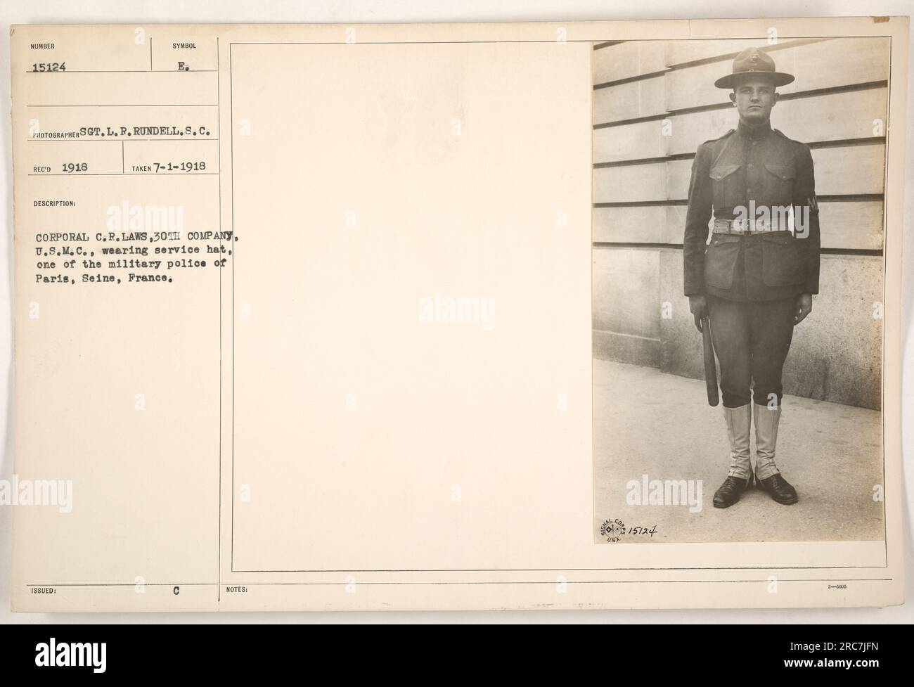 Corporal C.R. Laws, a member of the 30th Company, U.S.M.C., is seen ...