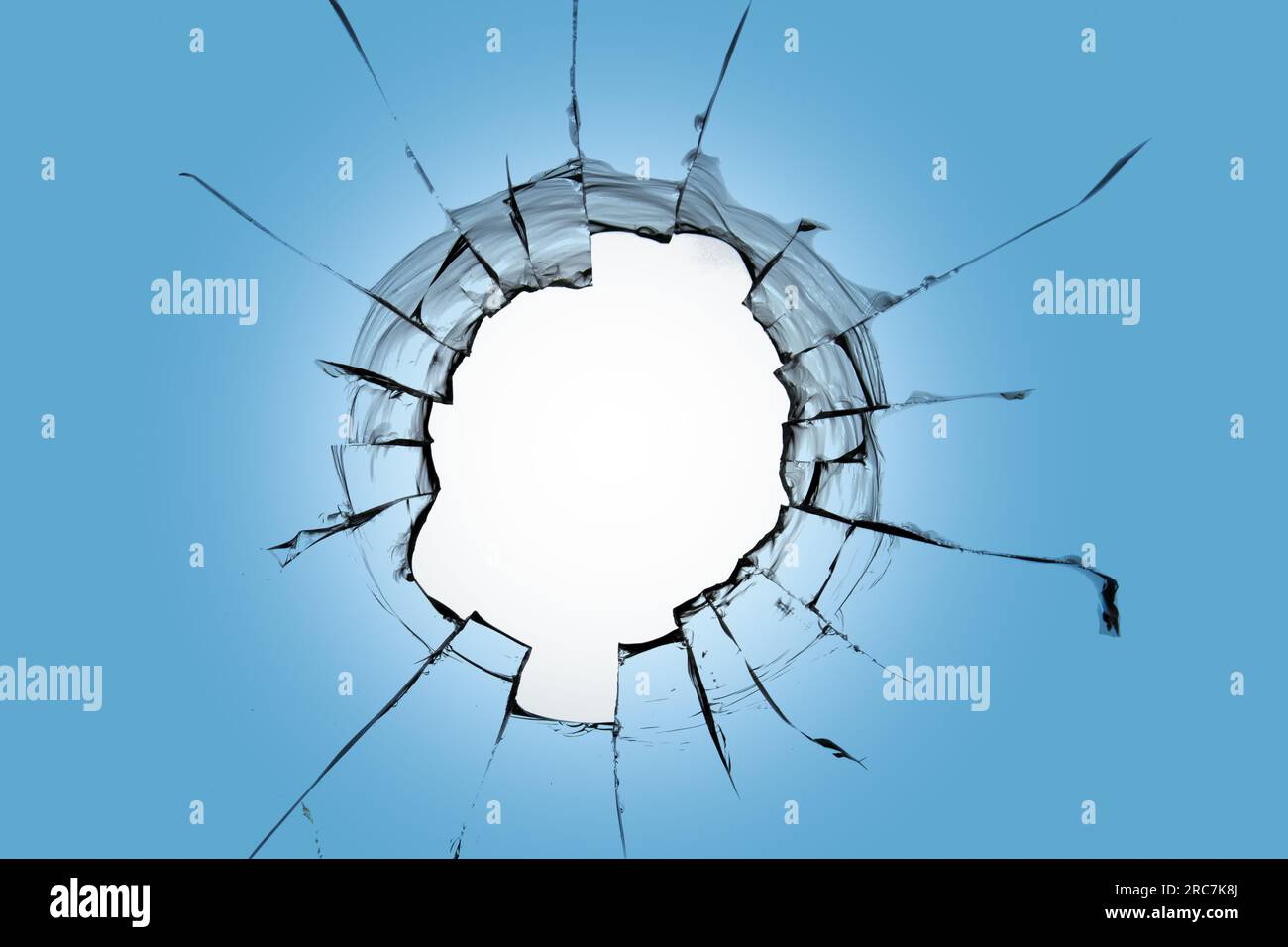 A big hole in the blue sky. Cracks on the window from breaking Stock ...