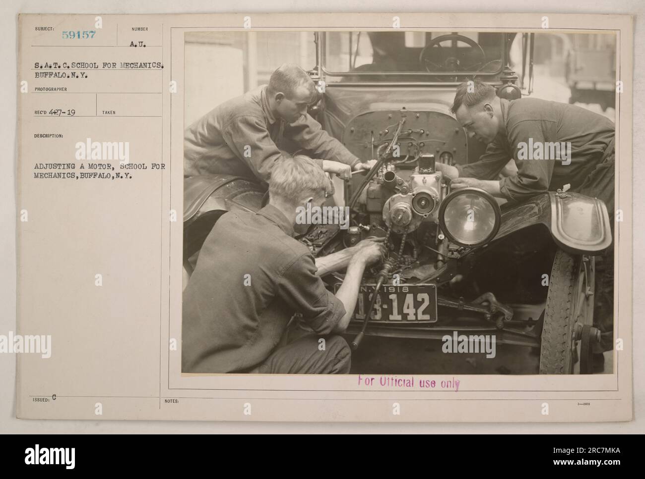 An S.A.T.C. mechanic adjusting a motor at the School for Mechanics in ...