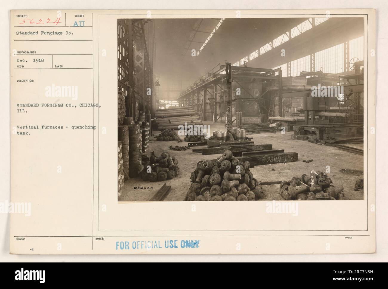 "A photograph of vertical furnaces and a quenching tank at Standard ...