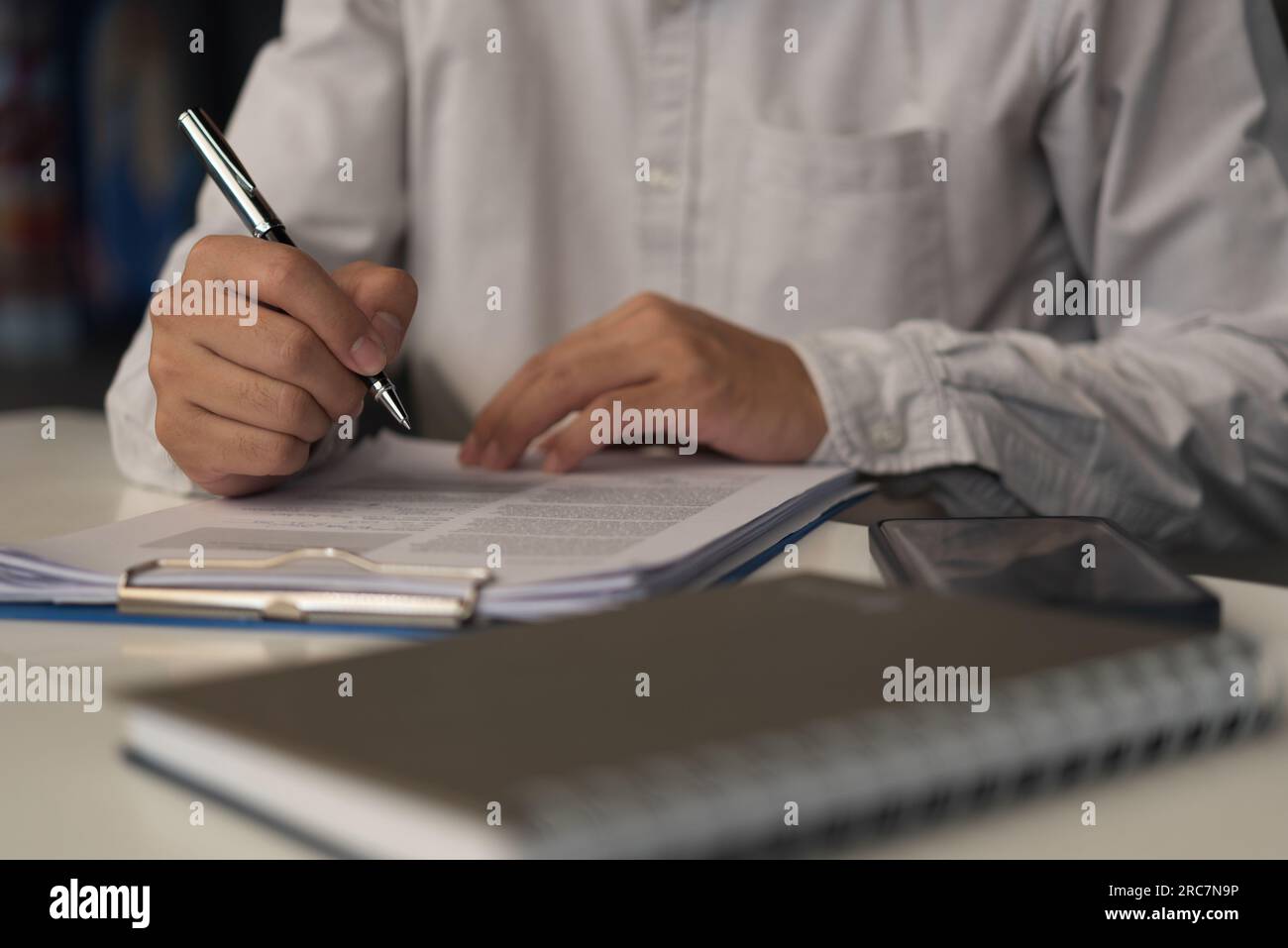 Business person Writing contract law and paper work for business and ...