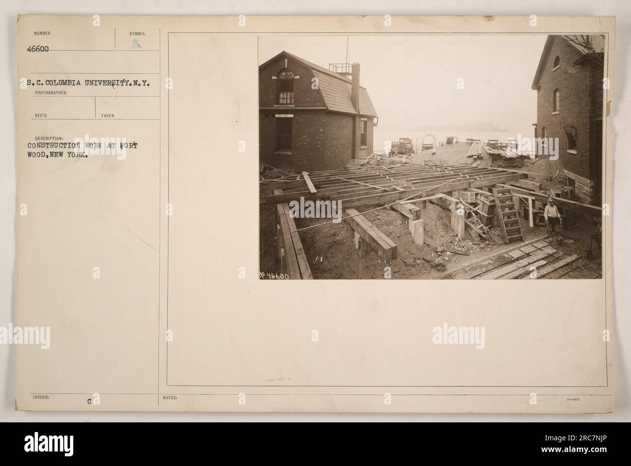 Workers can be seen engaged in construction activities at Fort Wood ...