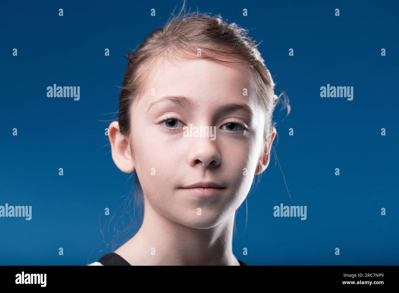 A formal portrait of a girl, mirroring old school albums or press ...