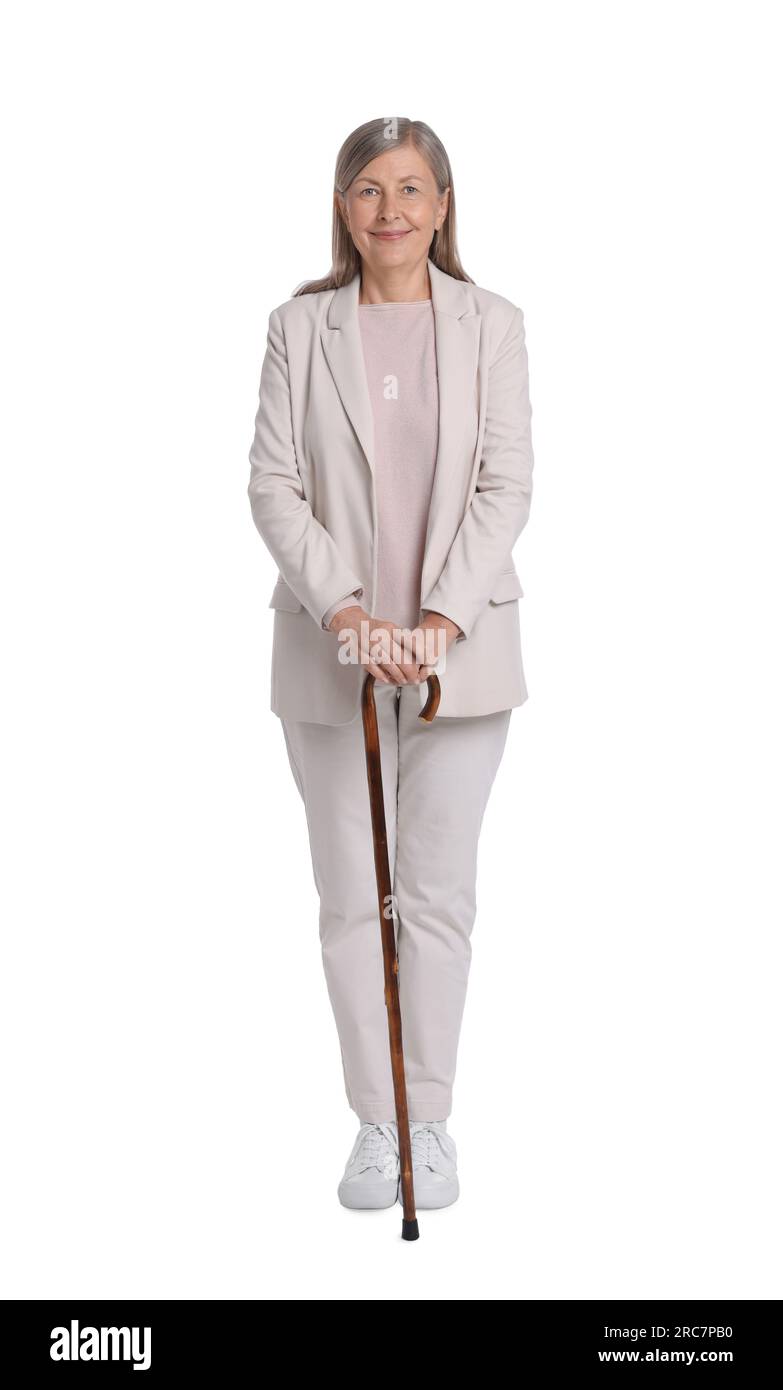 Senior woman with walking cane on white background Stock Photo - Alamy