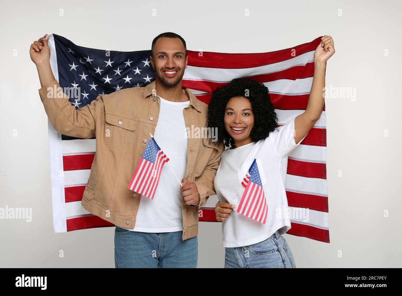 4th of July - Independence Day of USA. Happy couple with American flags ...