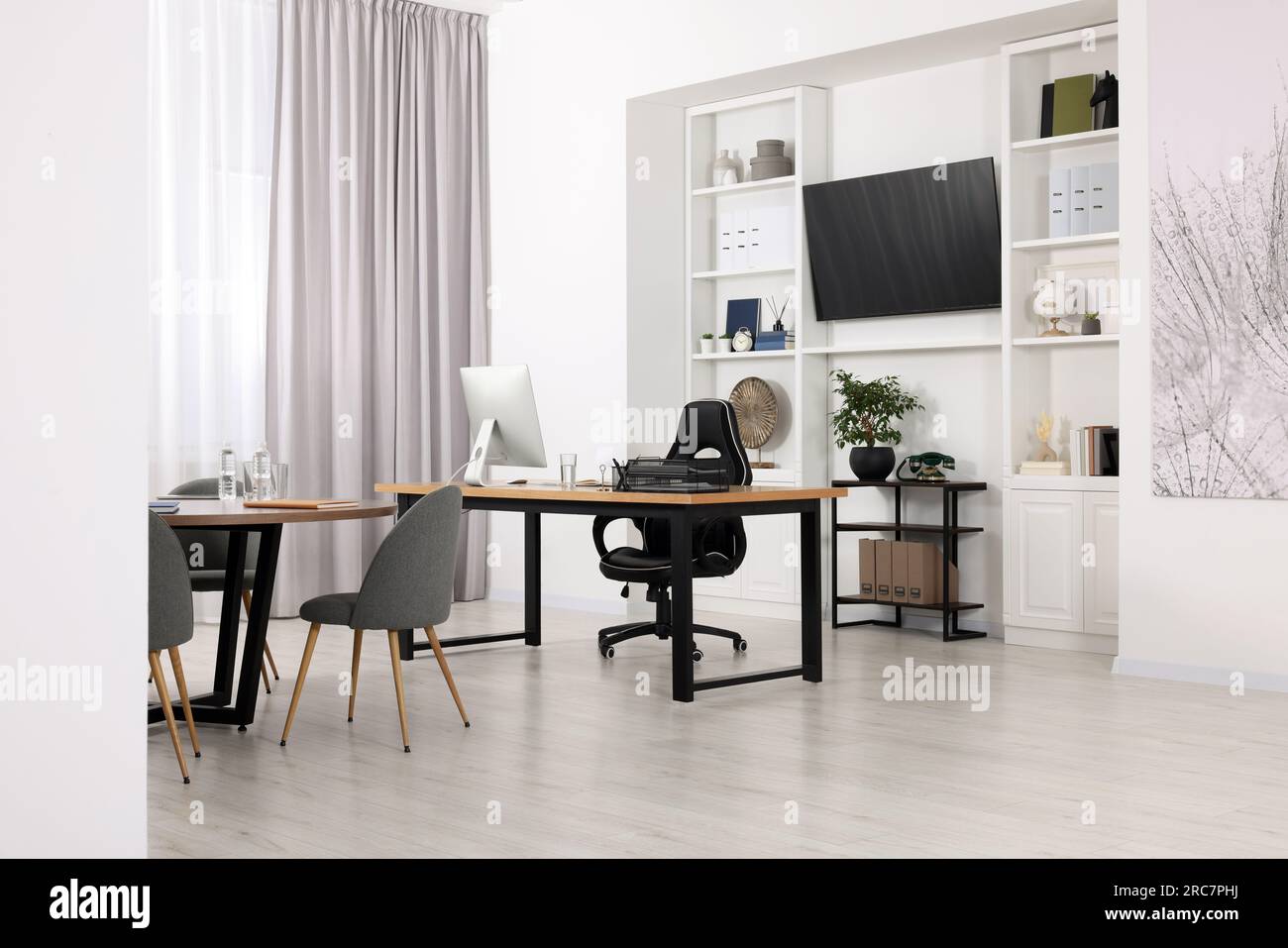 Stylish office with comfortable furniture and tv zone. Interior design ...