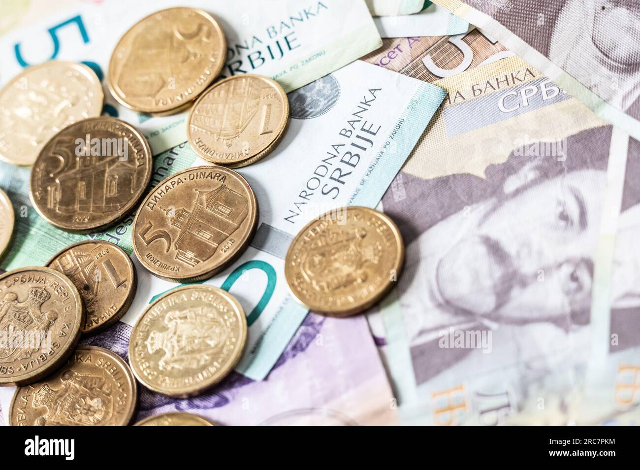 Rottweil, Germany. 12th July, 2023. Serbian dinar bills and coins lie ...