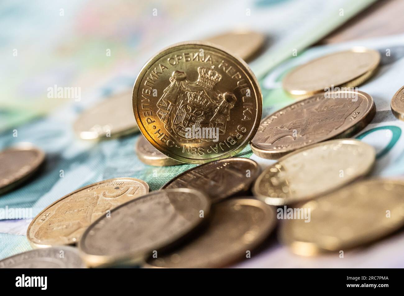 Rottweil, Germany. 12th July, 2023. Serbian dinar bills and coins lie ...