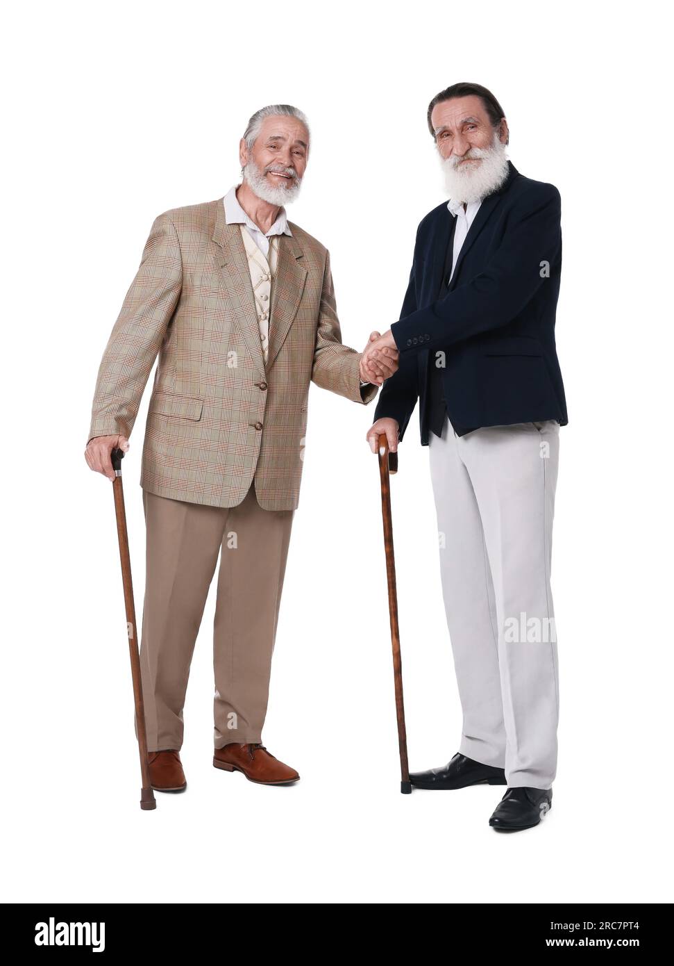 Senior men with walking canes shaking their hands on white background ...