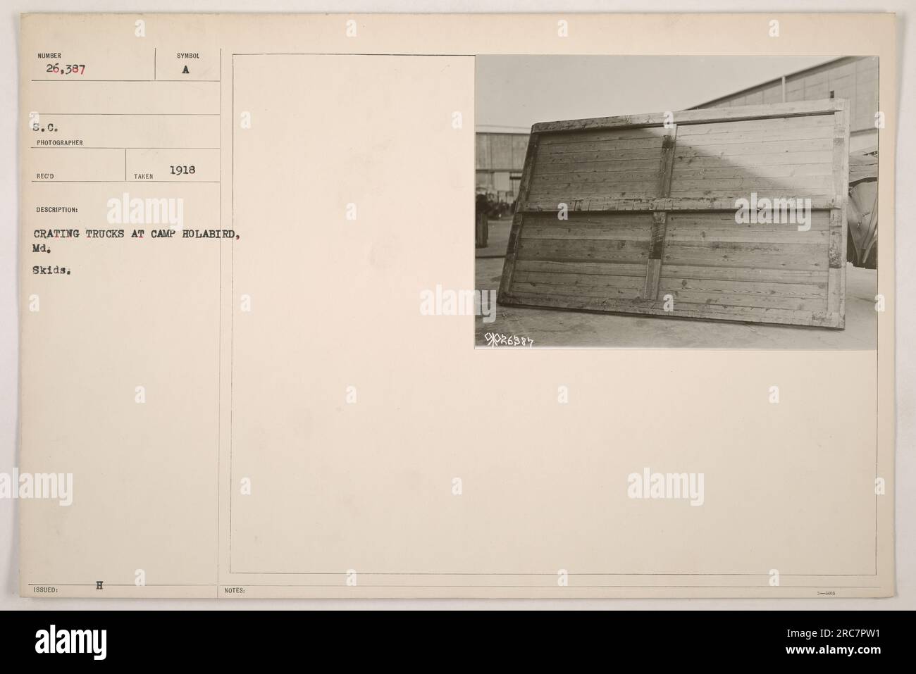 Image: Soldiers loading crates onto trucks at Camp Holabird in Maryland ...