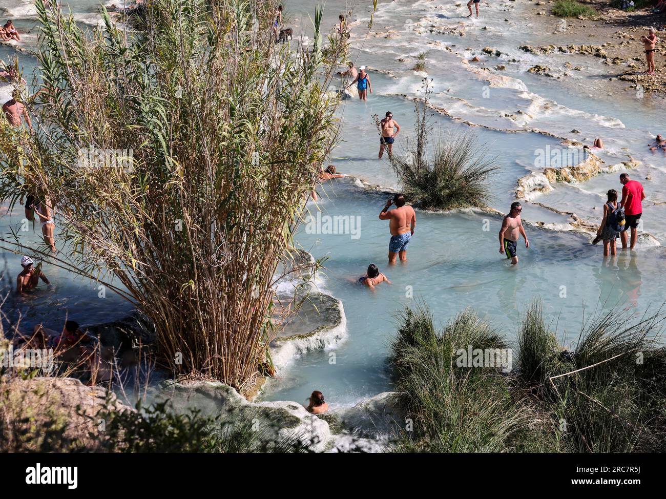 Saturnia, Italy - September 13, 2022: People are bathing in the hot ...
