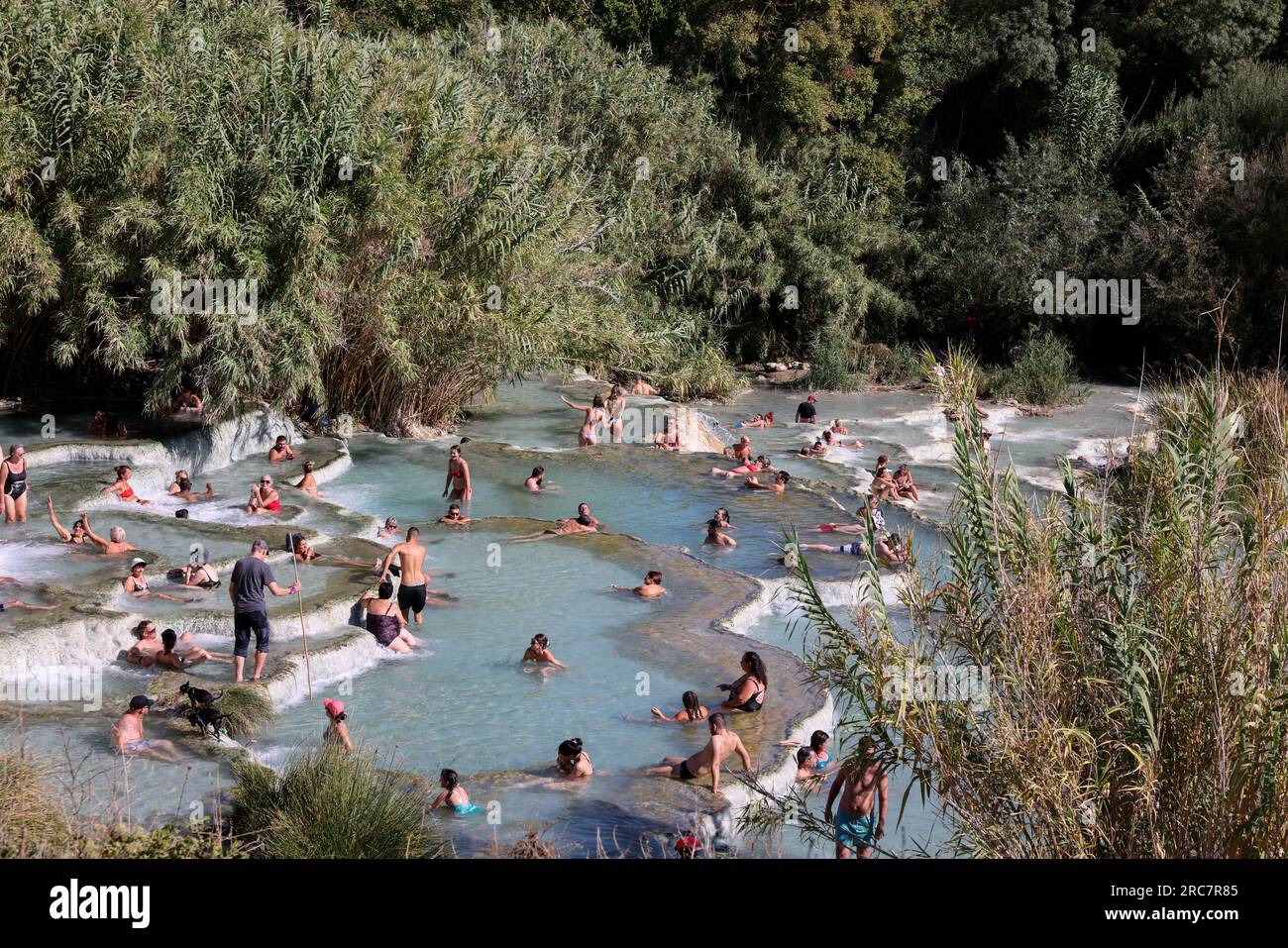Saturnia, Italy - September 13, 2022: People are bathing in the hot ...