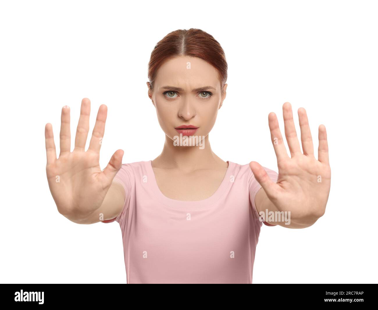 Woman showing stop gesture on white background Stock Photo - Alamy